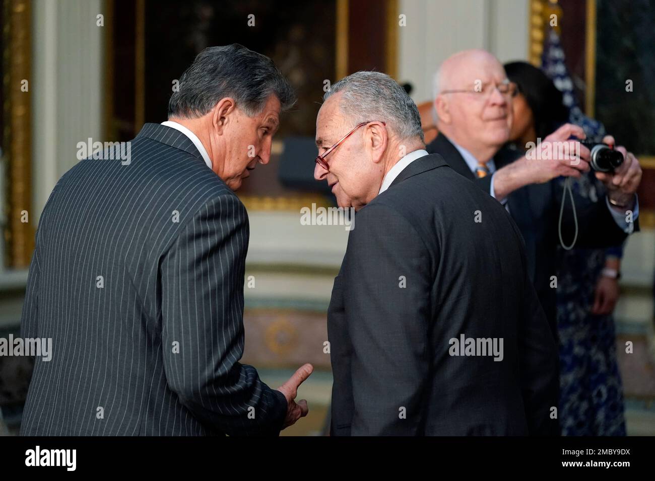 Sen. Joe Manchin, D-W.Va., talks with Senate Majority Leader Chuck ...