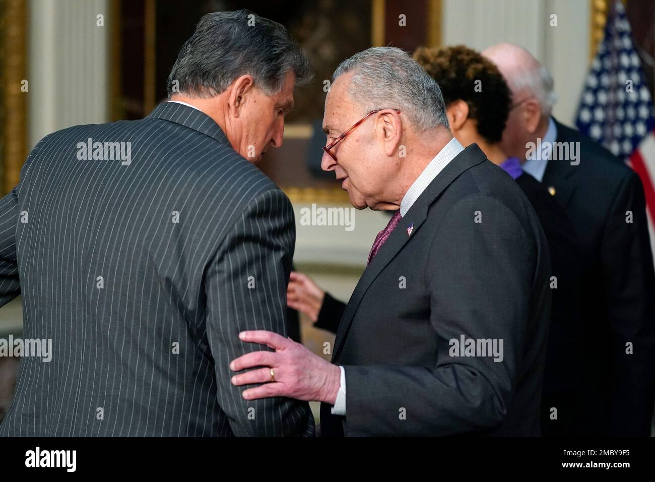 Sen. Joe Manchin, D-W.Va., talks with Senate Majority Leader Chuck ...
