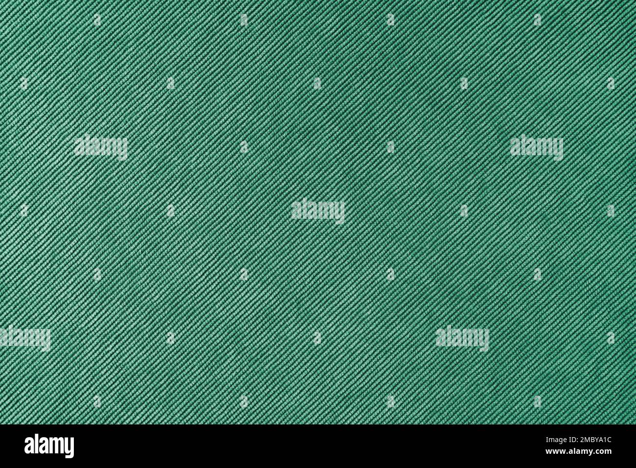Texture background of velours green fabric. Upholstery velveteen ...
