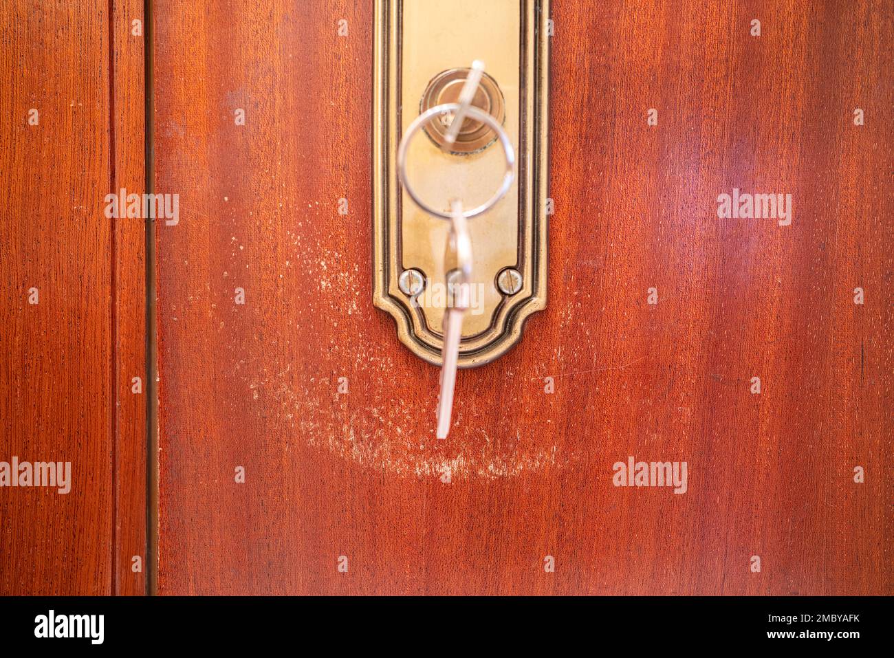 Detail of a door lock scratched by keys Stock Photo - Alamy