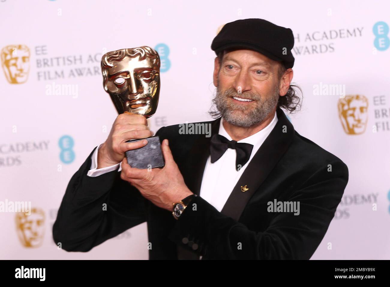 Troy Kotsur holds his Supporting Actor award for his role in the film ...