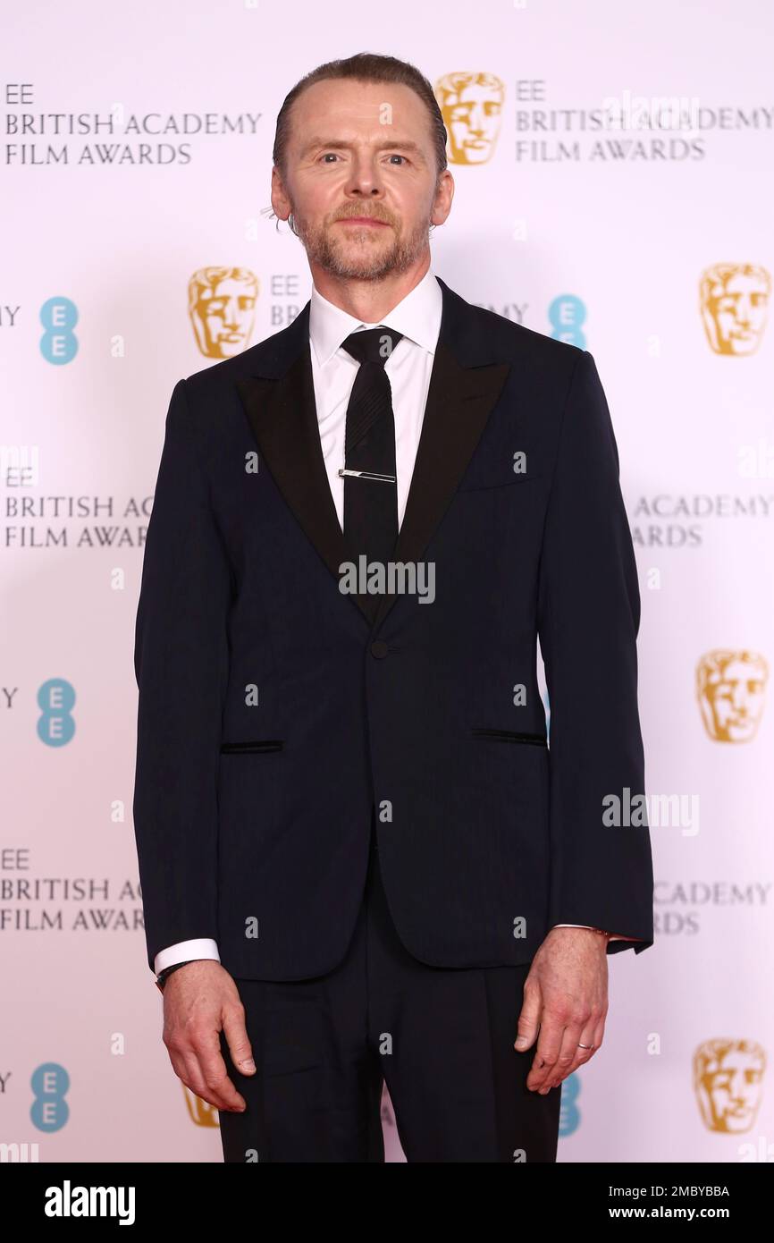 Simon Pegg poses for photographers backstage at the 75th British ...