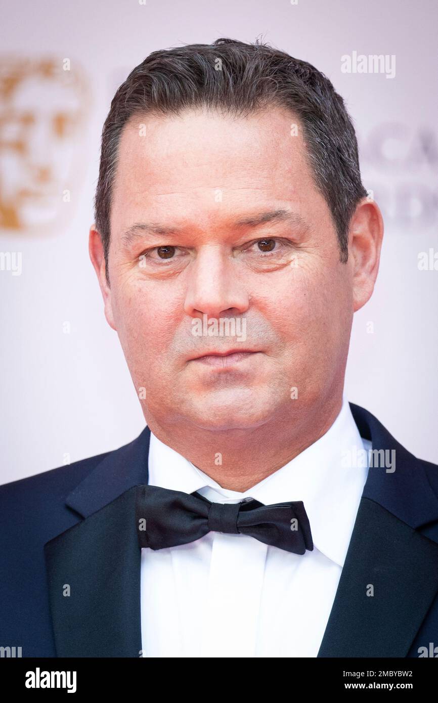 Kevin Messick poses for photographers upon arrival at the 75th British ...