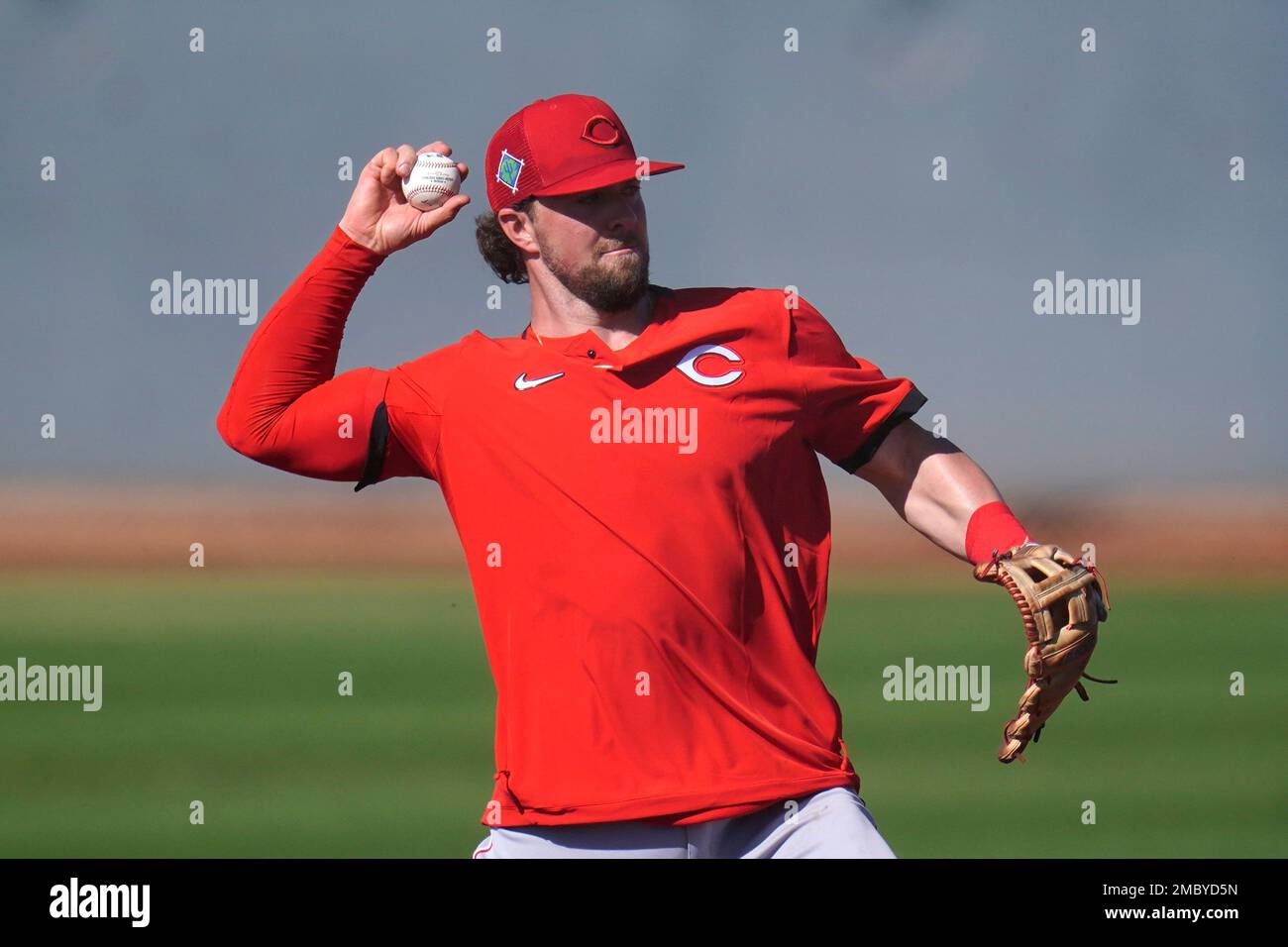 Cincinnati Reds shortstop Kyle Farmer throws to first base during a ...