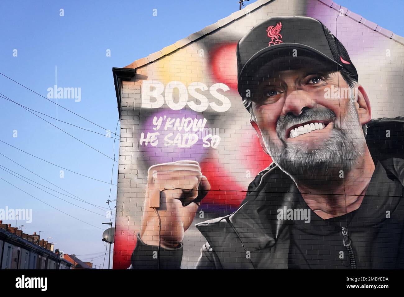 A mural of Liverpool manager Jurgen Klopp on a house near the ground ...