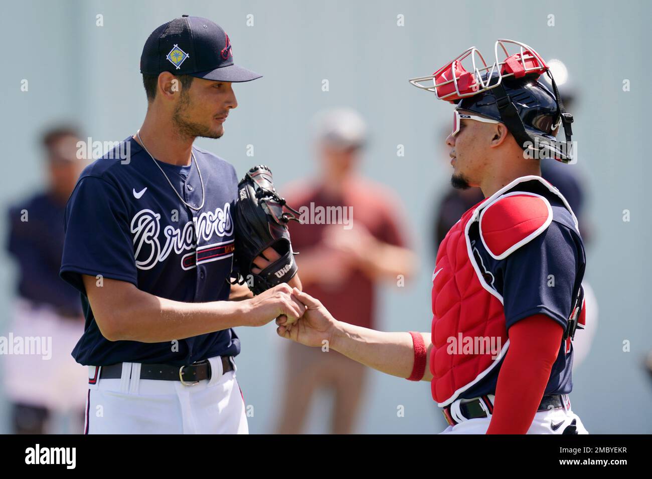 Atlanta Braves pitcher Freddy Tarnok, left, talks with catcher William ...