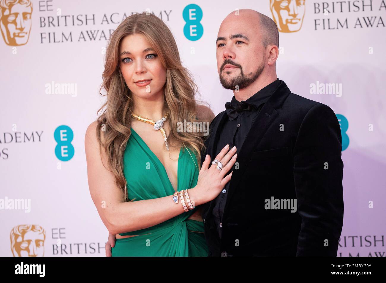 Becky Hill and Charlie Gardner pose for photographers upon arrival at ...