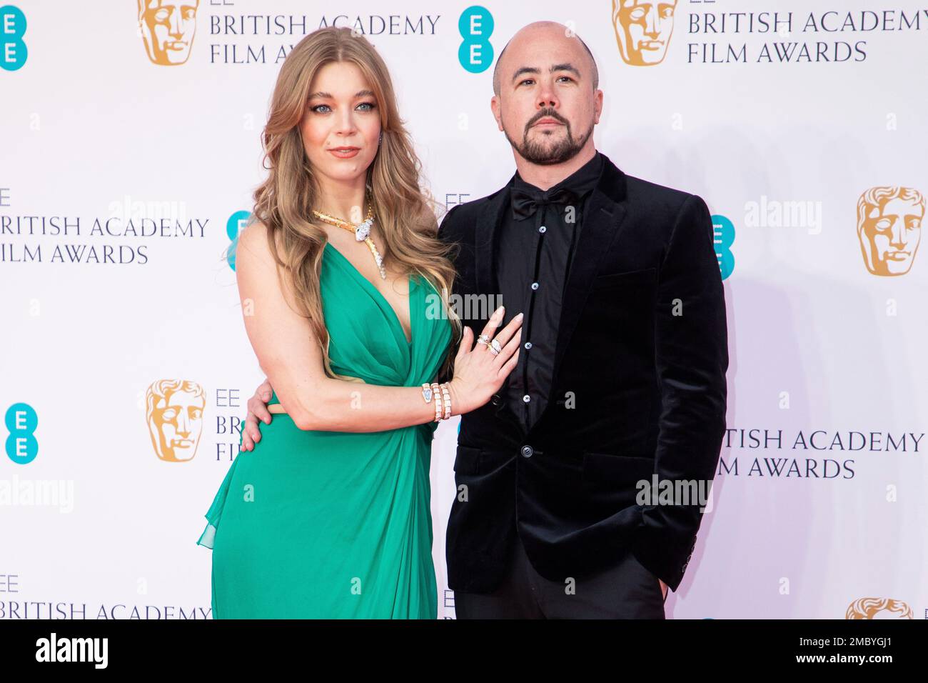 Becky Hill and Charlie Gardner pose for photographers upon arrival at ...