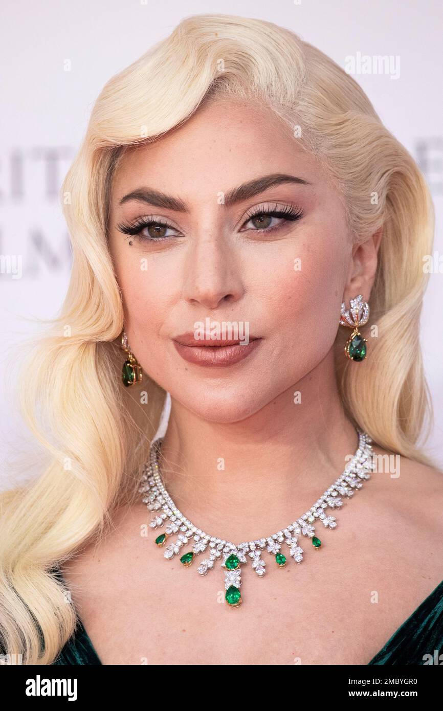 Lady Gaga poses for photographers upon arrival at the 75th British ...