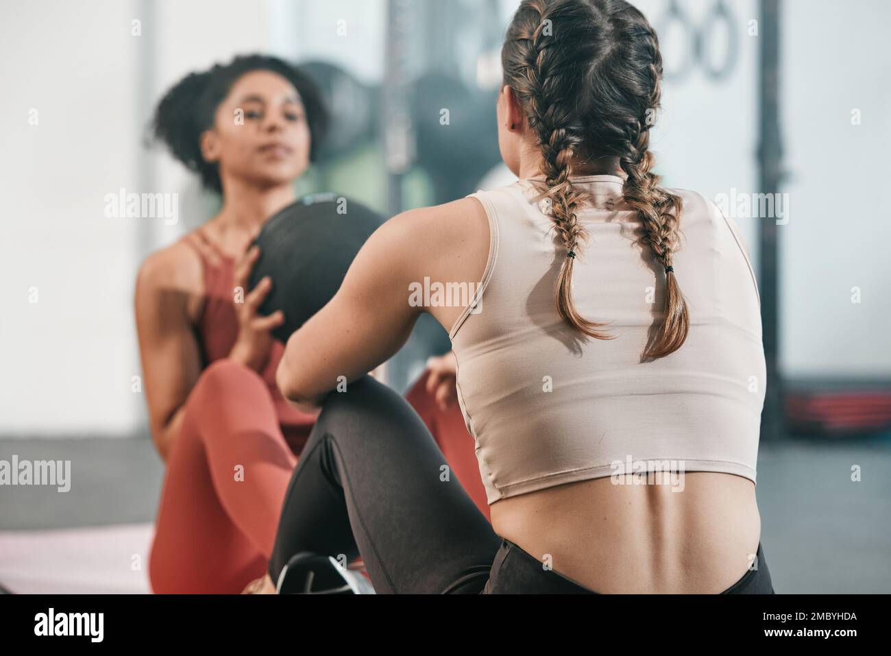 Fitness, gym or friends training with medicine ball in workout or exercise with resilience or ...