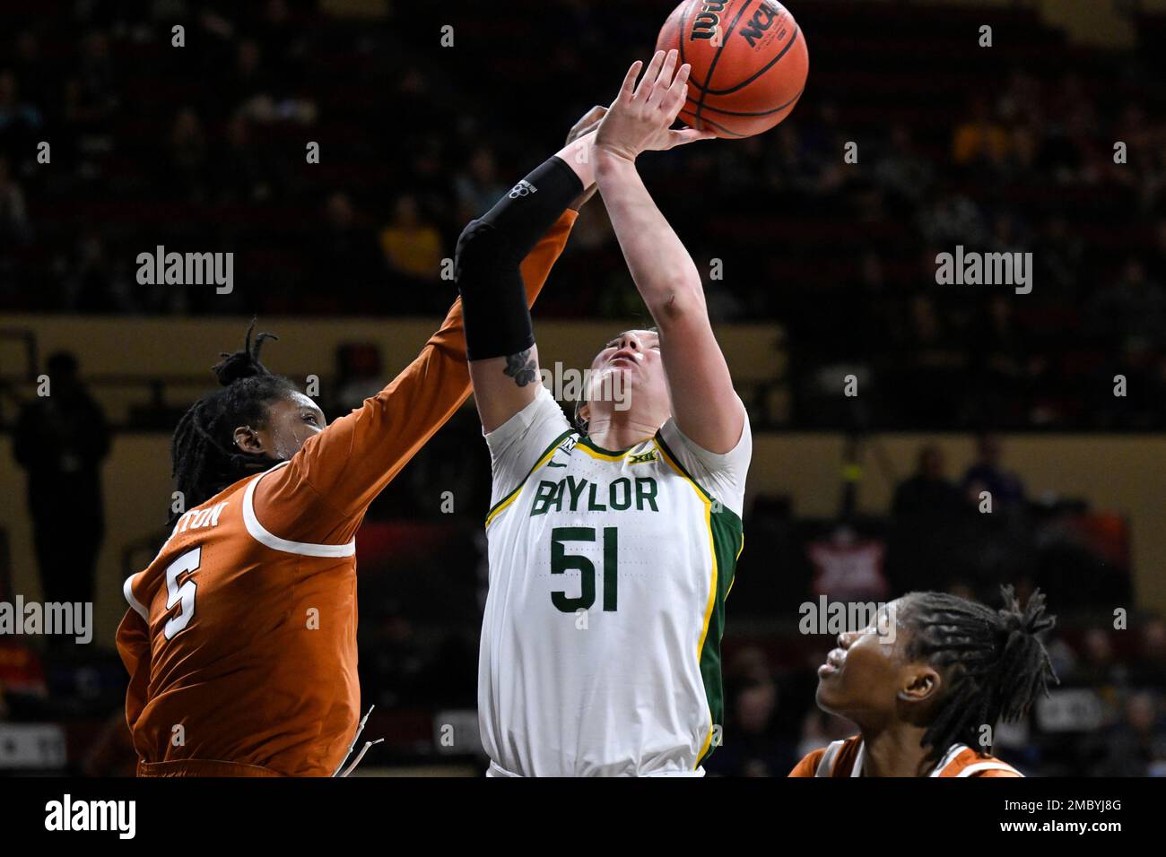 Texas forward DeYona Gaston (5) blocks a shot by Baylor forward Caitlin ...