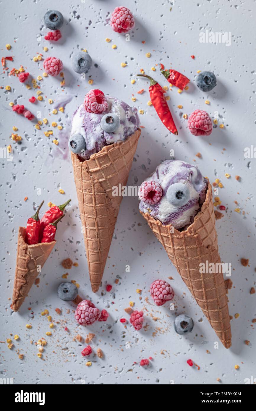 Cold and spicy ice cream with fruits and chilli. New flavors of ice ...