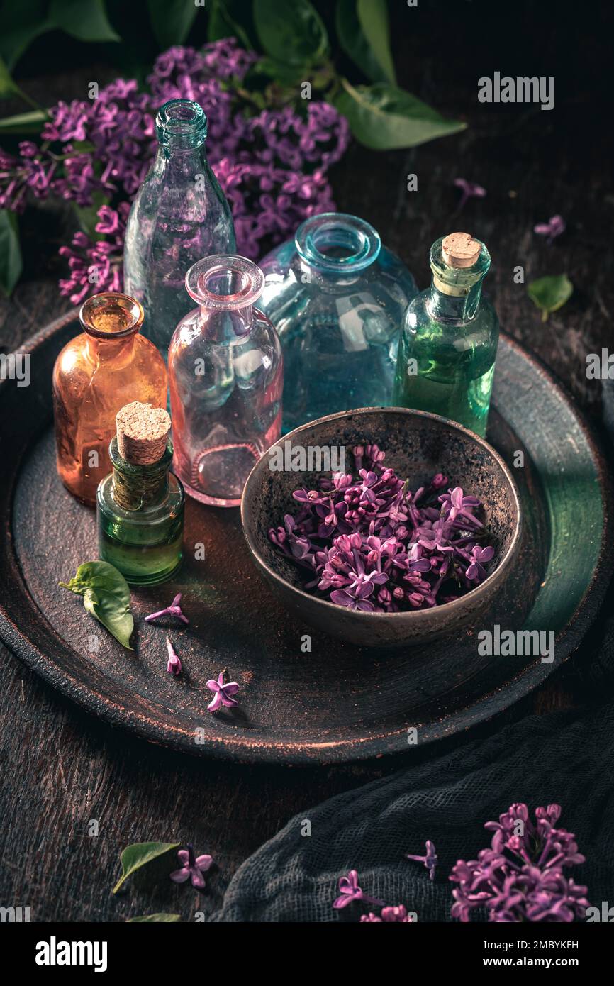 Unique and aromatic lilac aromatic oil. Lilac flower products. Blooming ...