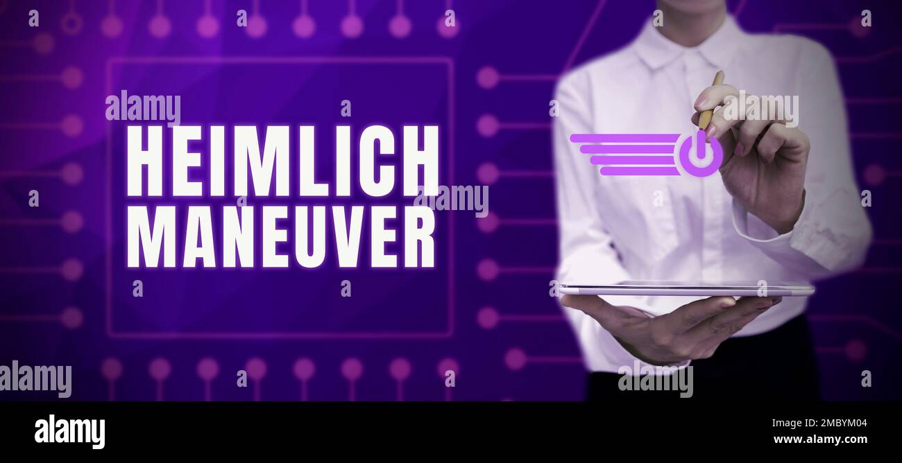 Hand writing sign Heimlich Maneuver. Word Written on application of ...