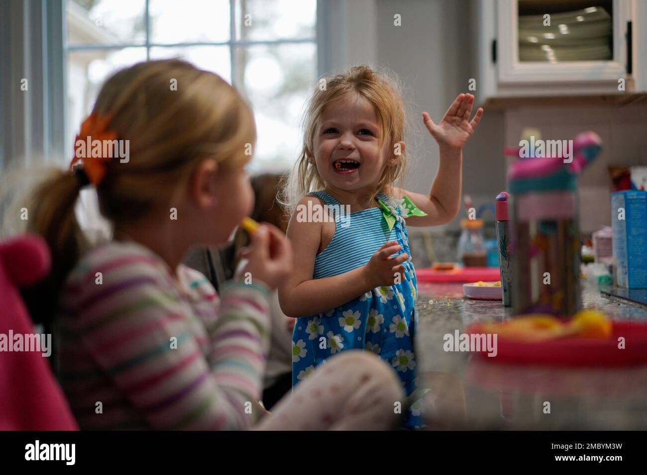 Alyssa Carpenter, 2, laughs as she and her sister Audrey Carpenter, 5 ...