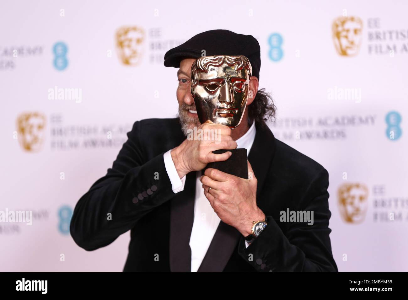 Troy Kotsur holds his Supporting Actor award for his role in the film ...