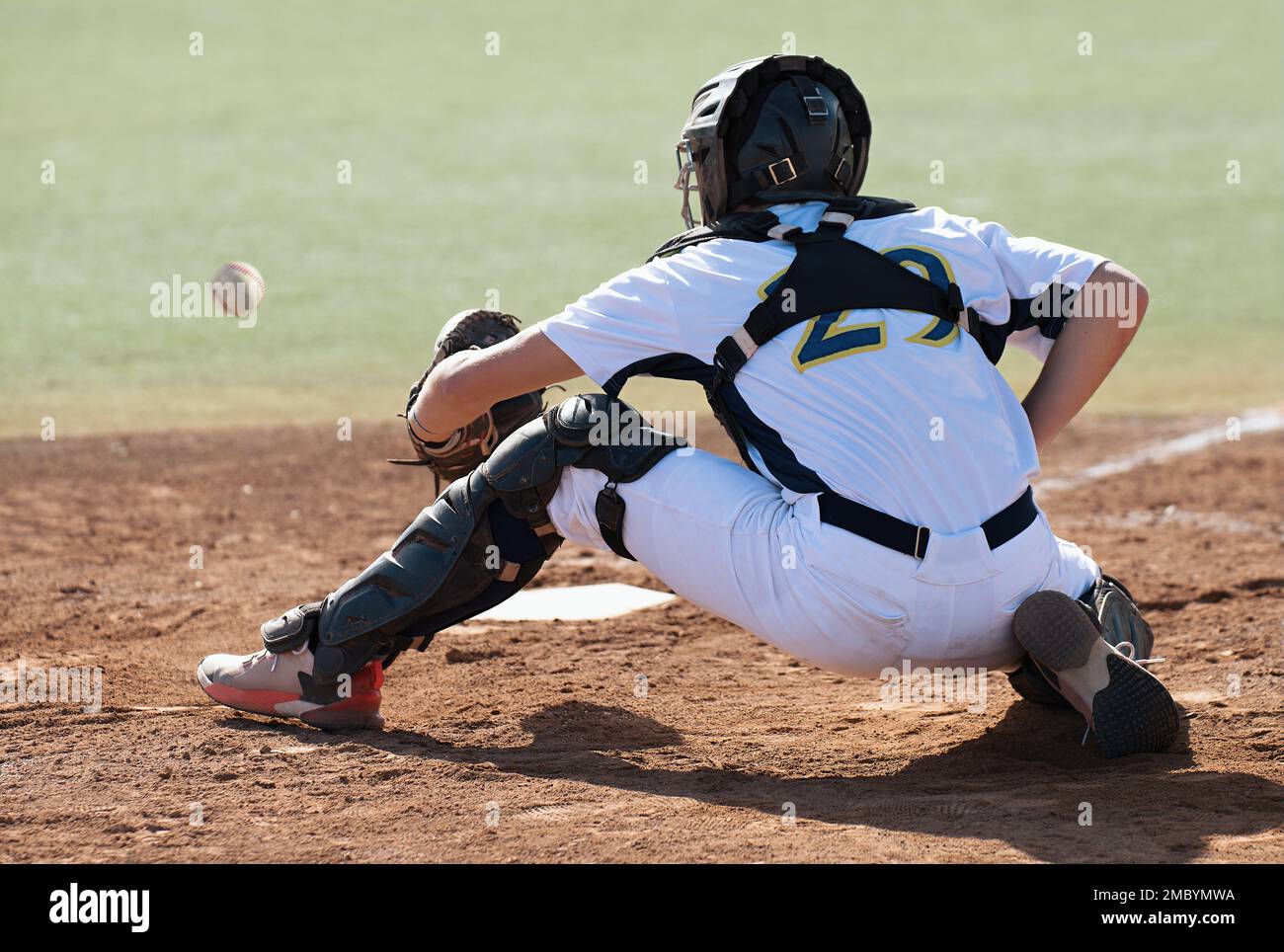 Baseball catcher during game, baseball catcher reaching to catch ball ...