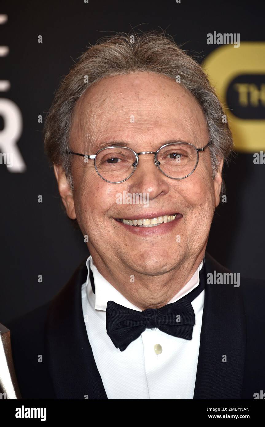 Billy Crystal poses in the press room with his lifetime achievement ...