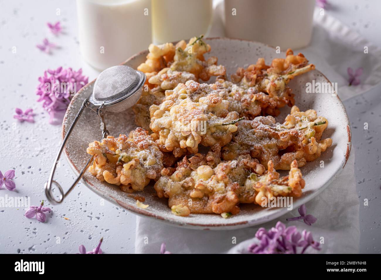 Homemade and tasty fried lilac flower with powdered sugar. Sweet ...
