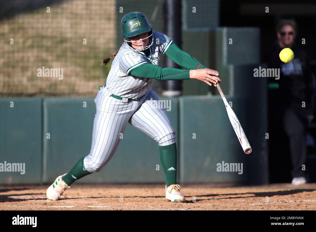 George Mason catcher Nicole Bechtel (36) takes a swing during an NCAA ...