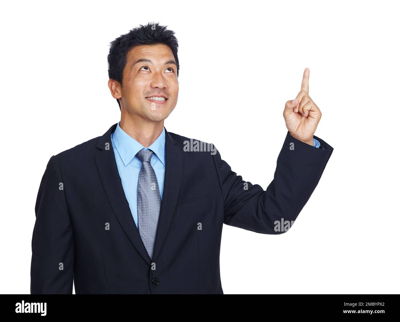 Mockup, pointing and idea with a business asian man in studio isolated ...