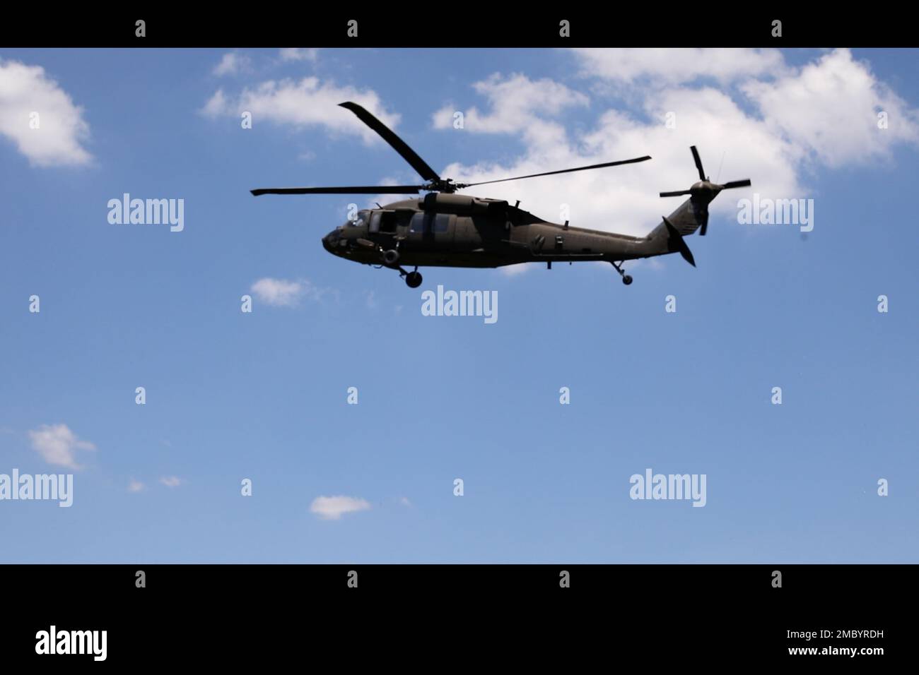 A UH-60 Blackhawk hovers overhead at a firing range during the aerial ...