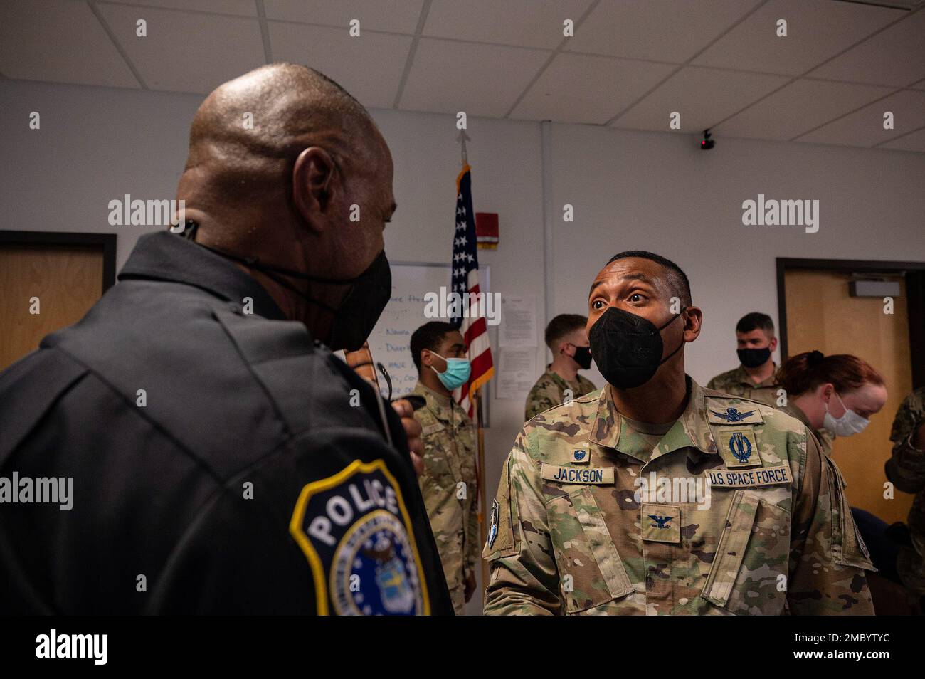 Col. Marcus Jackson, Space Base Delta 2 commander, congratulates Mykul ...