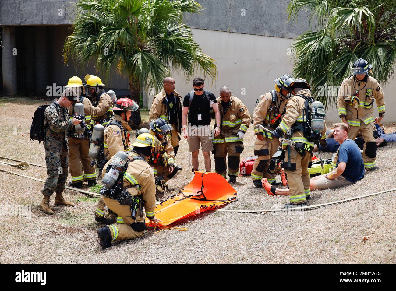 U.S. service members and Federal Firefighters prepare a medical sled in ...