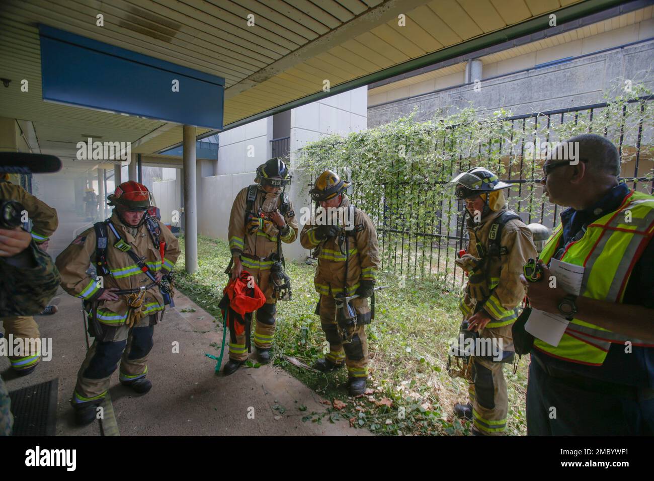 Federal Firefighters take part in a post-exercise discussion during ...