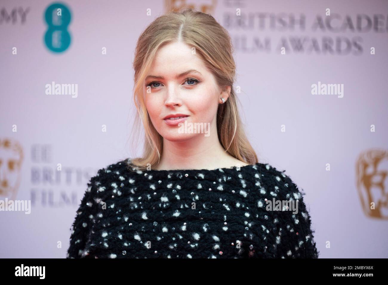 Ellie Bamber poses for photographers upon arrival at the 75th British ...