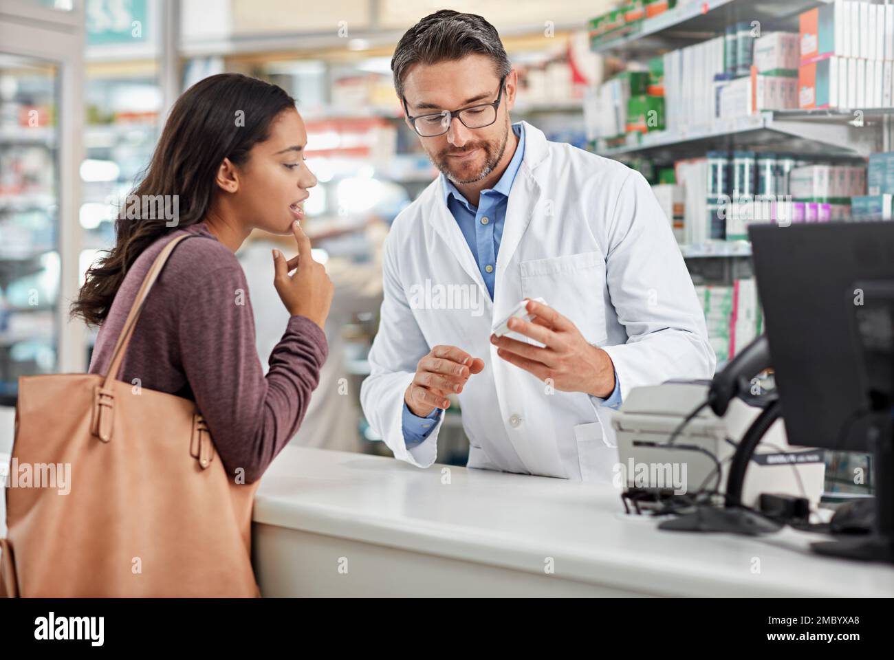 Help, consulting and thinking pharmacy customer at counter for ...