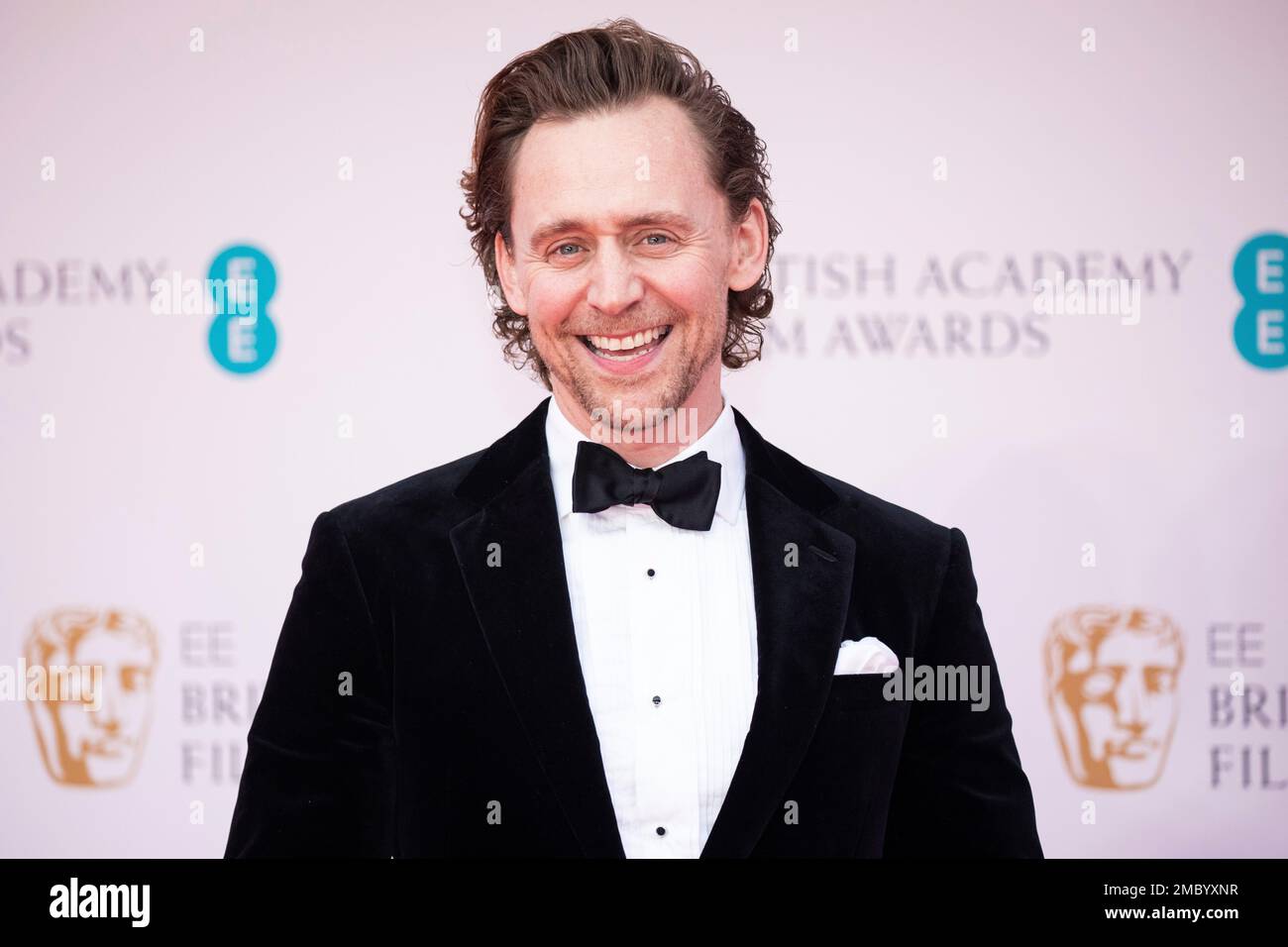 Tom Hiddleston poses for photographers upon arrival at the 75th British ...