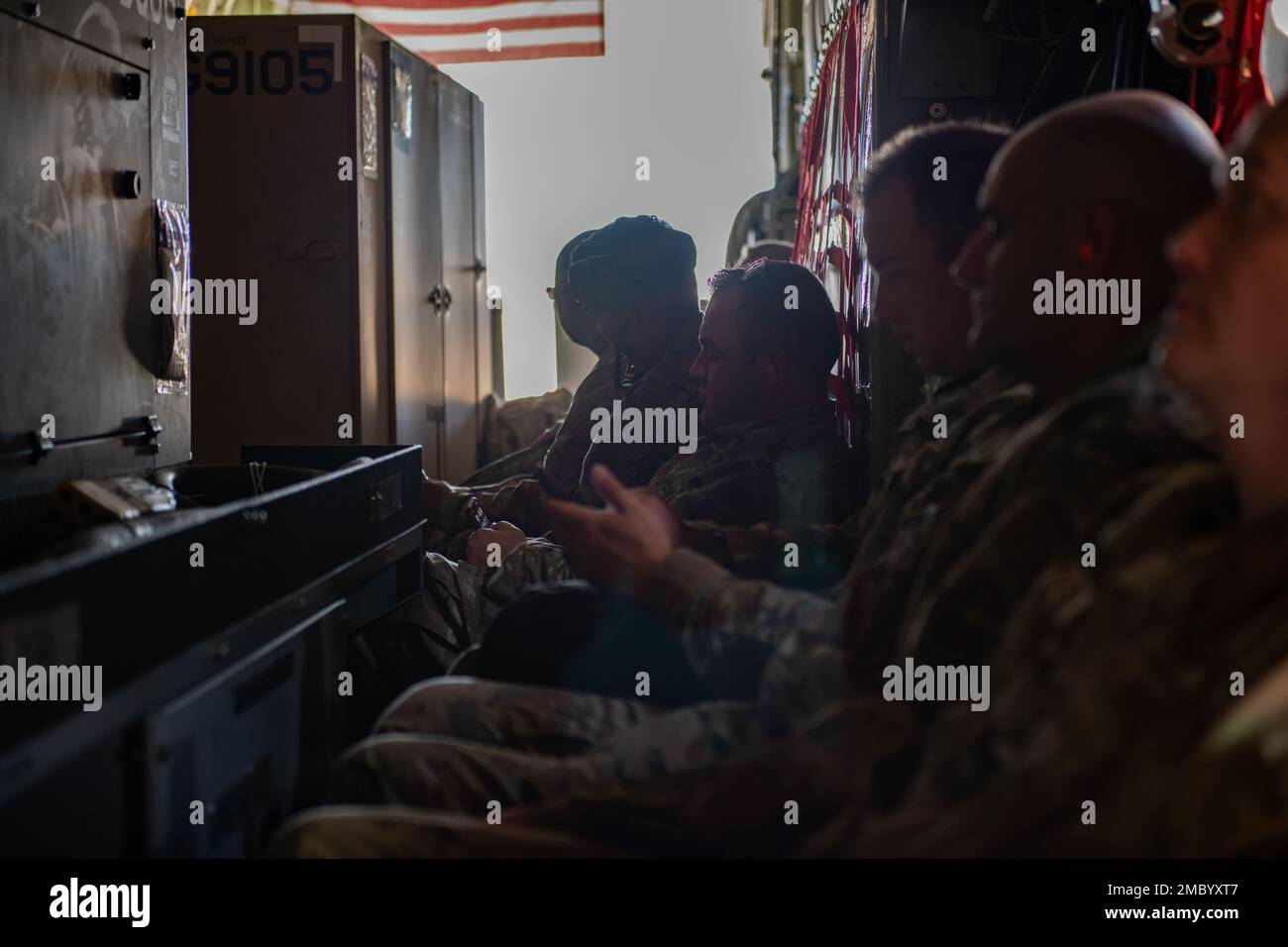 U.S. Air Force Airmen with the 163d Attack Wing remain seated and ...