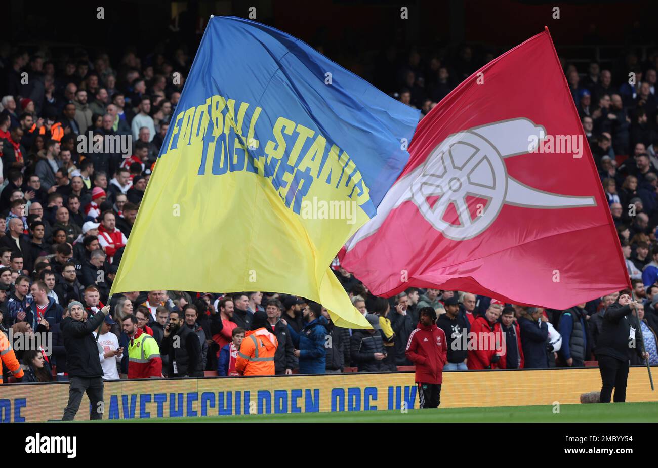 Arsenal supporters wave a flag with Ukranian national color before the ...
