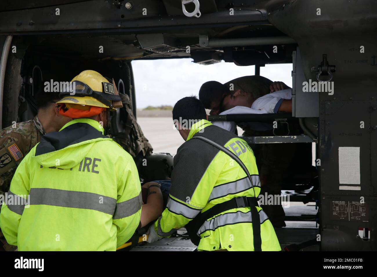 Federal Firefighters and U.S. Army soldiers evaluate casualties during ...