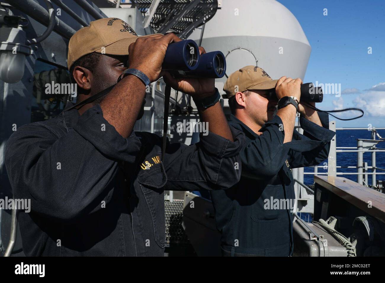 PACIFIC OCEAN (June 23, 2022) Lt. j.g. Derrick Snell, left, from ...