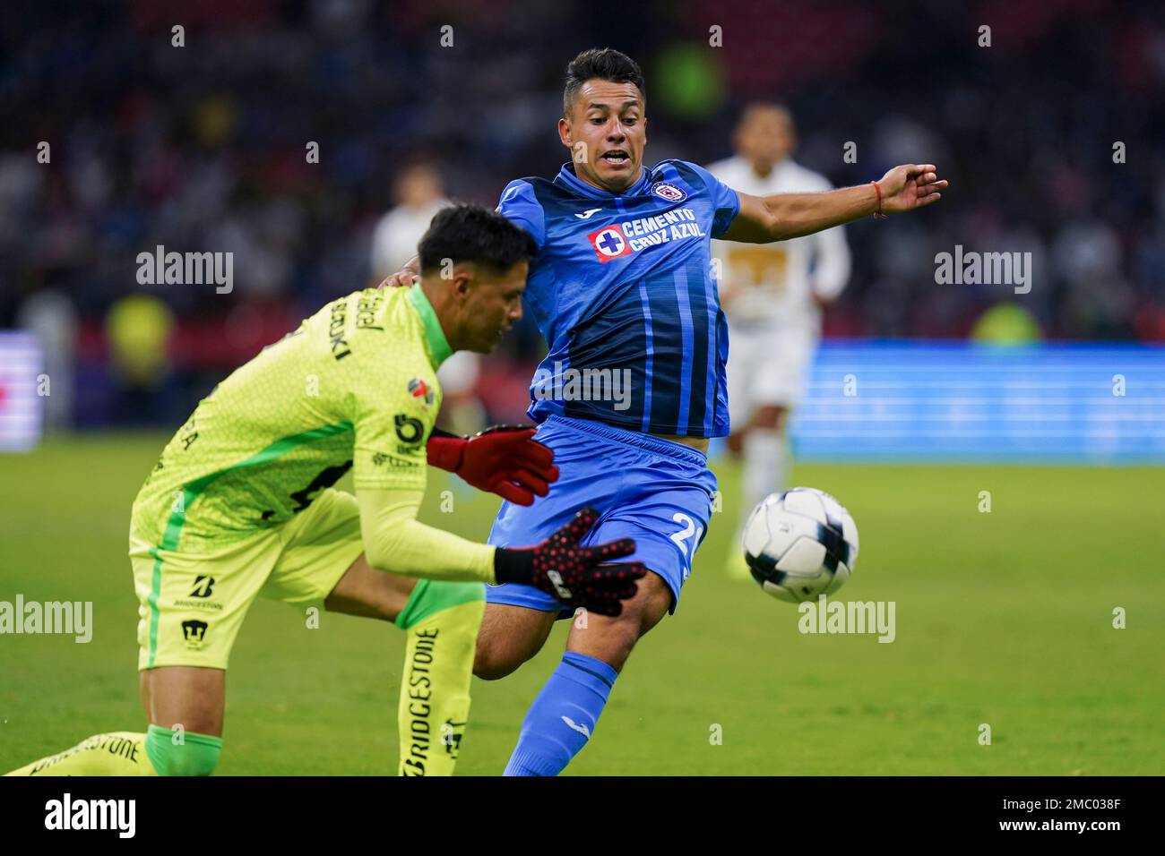 Cruz Azul's Ivan Morales, center, and Pumas' goalkeeper Alfredo ...