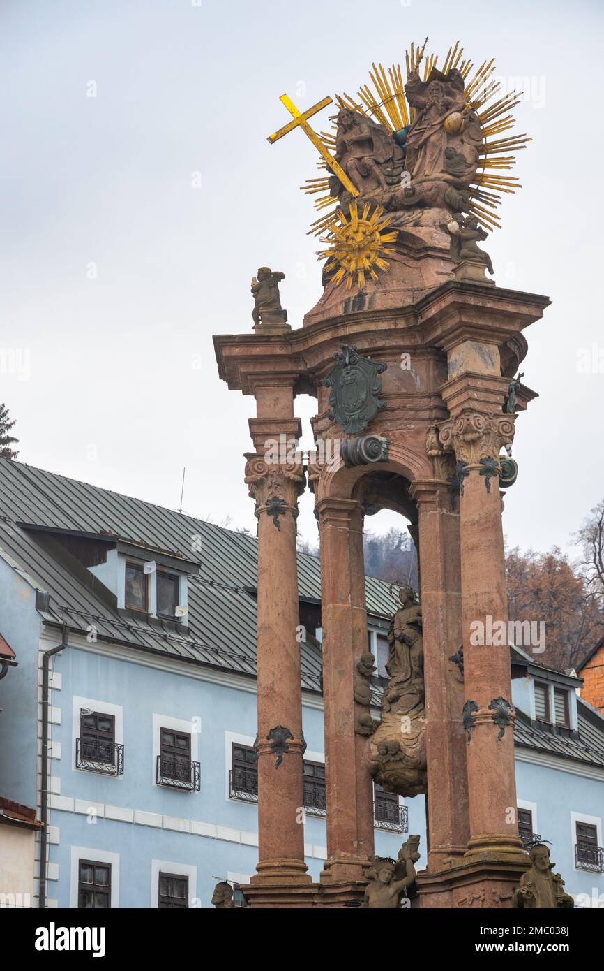 The historical Trinity Square with a monumental plague column in Banska Stiavnica at evening ...