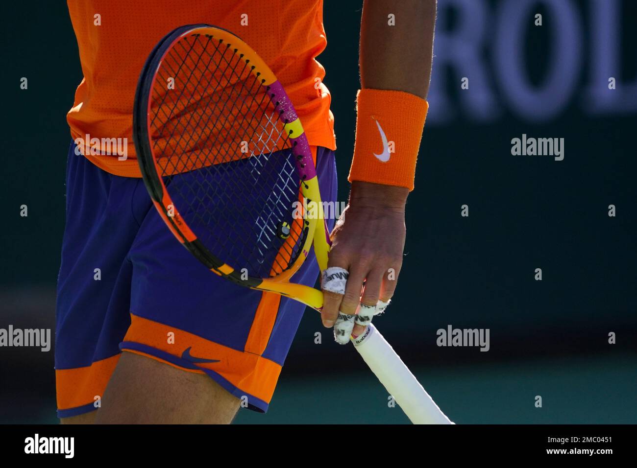 Rafael Nadal, of Spain, holds his racket during a match against ...