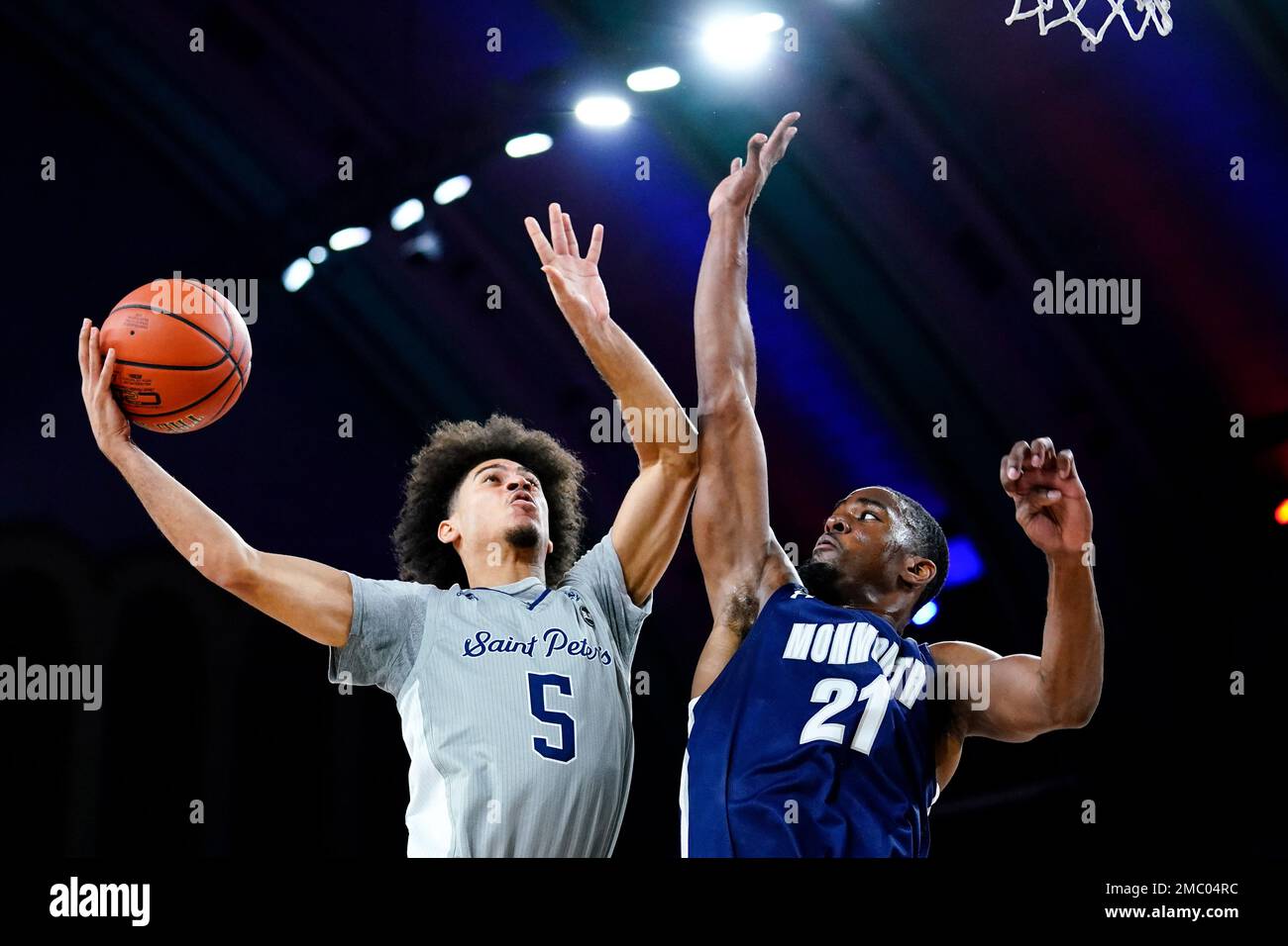 St. Peter's Daryl Banks III (5) goes up to shoot against Monmouth's ...