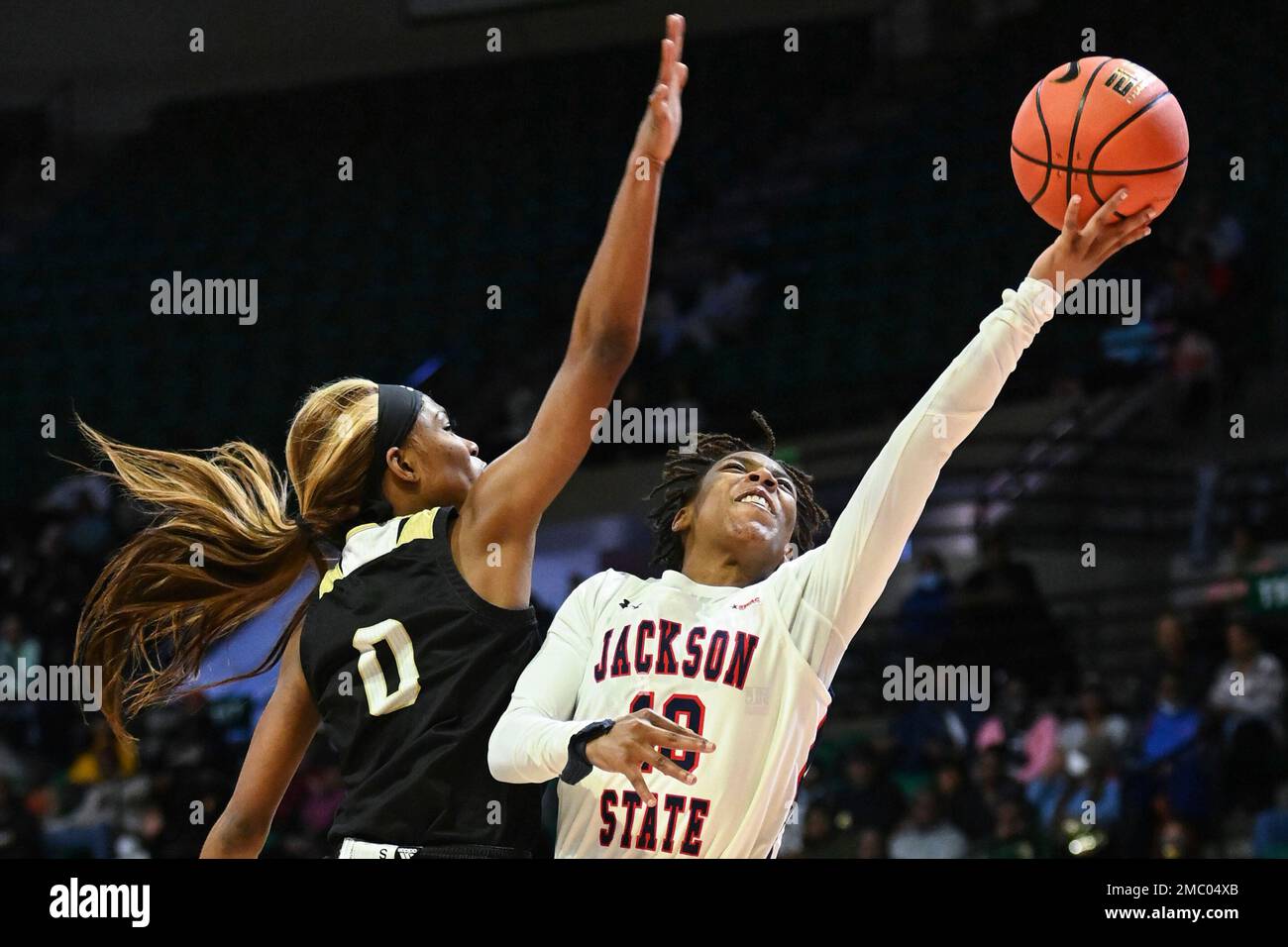Alabama State guard Ayana Emmanuel (0) fouls Jackson State point guard ...