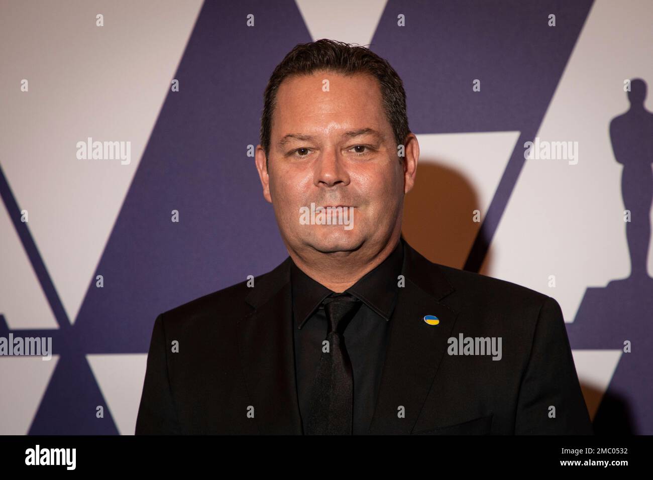 Kevin Messick poses for photographers upon arrival at the Academy ...