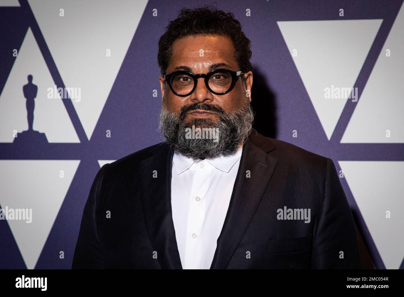 Joseph Patel poses for photographers upon arrival at the Academy Awards ...