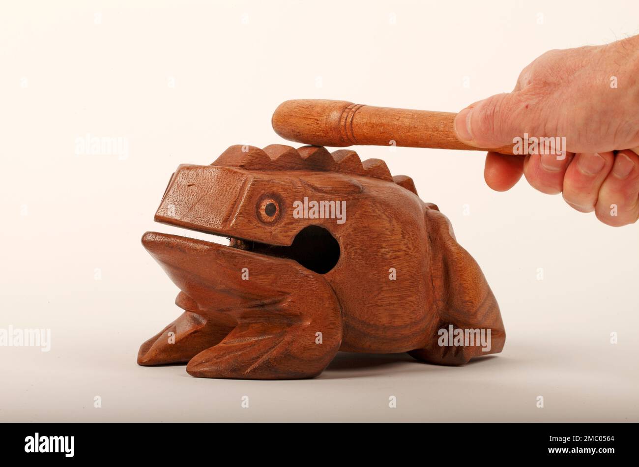 Large wooden Frog scraper guiro Stock Photo - Alamy