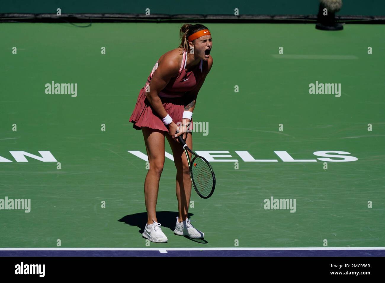 Aryna Sabalenka, of Belarus, reacts after a shot to Jasmine Paolini, of Italy, at the BNP ...