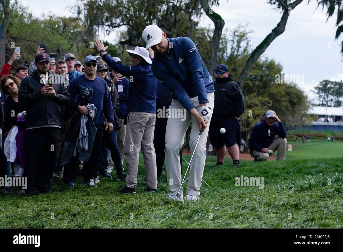 Daniel Berger chips to the 18th green during the second round of play ...