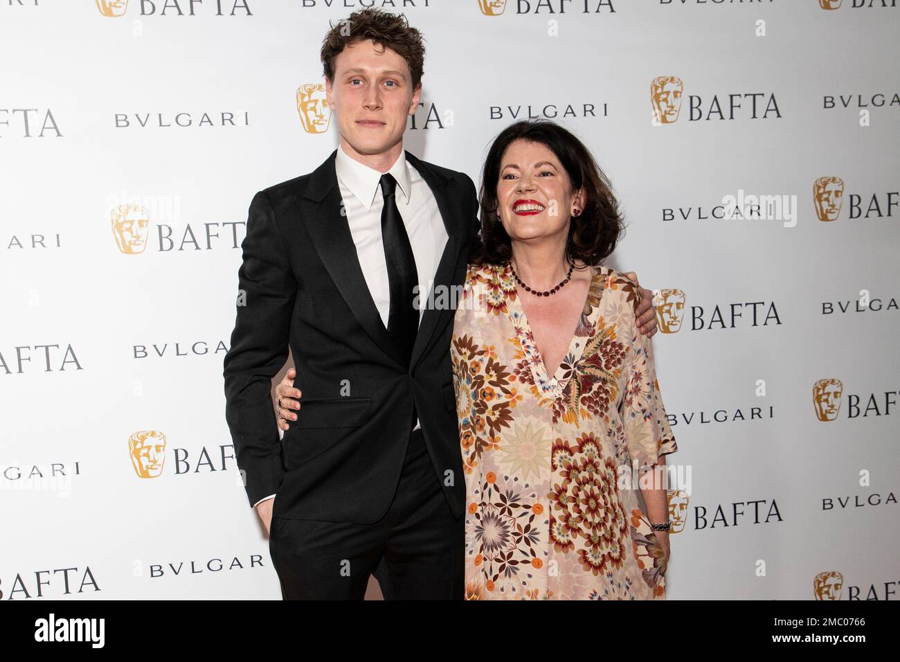George MacKay, left, and Pippa Harris pose for photographers upon ...