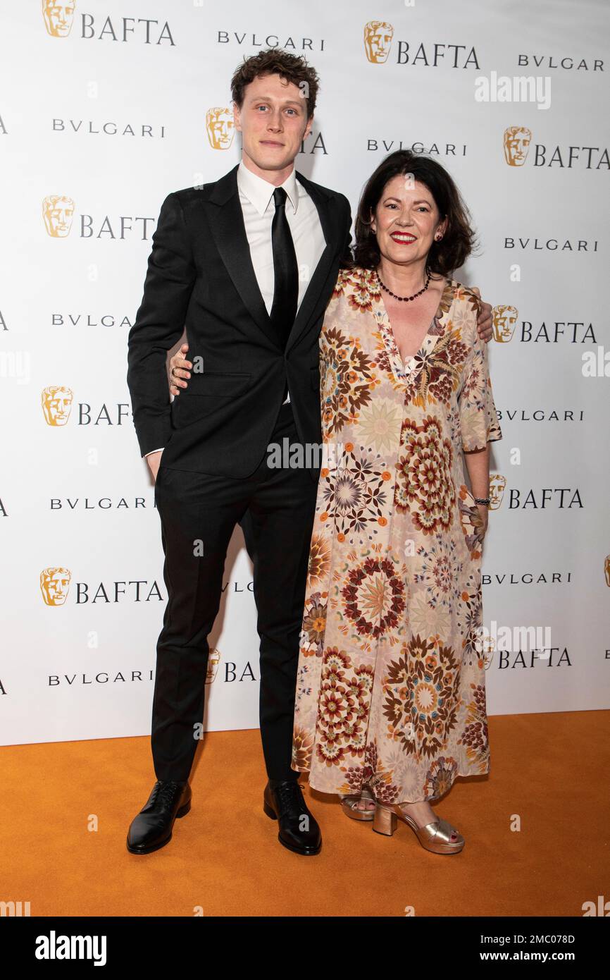 George MacKay, left, and Pippa Harris pose for photographers upon ...