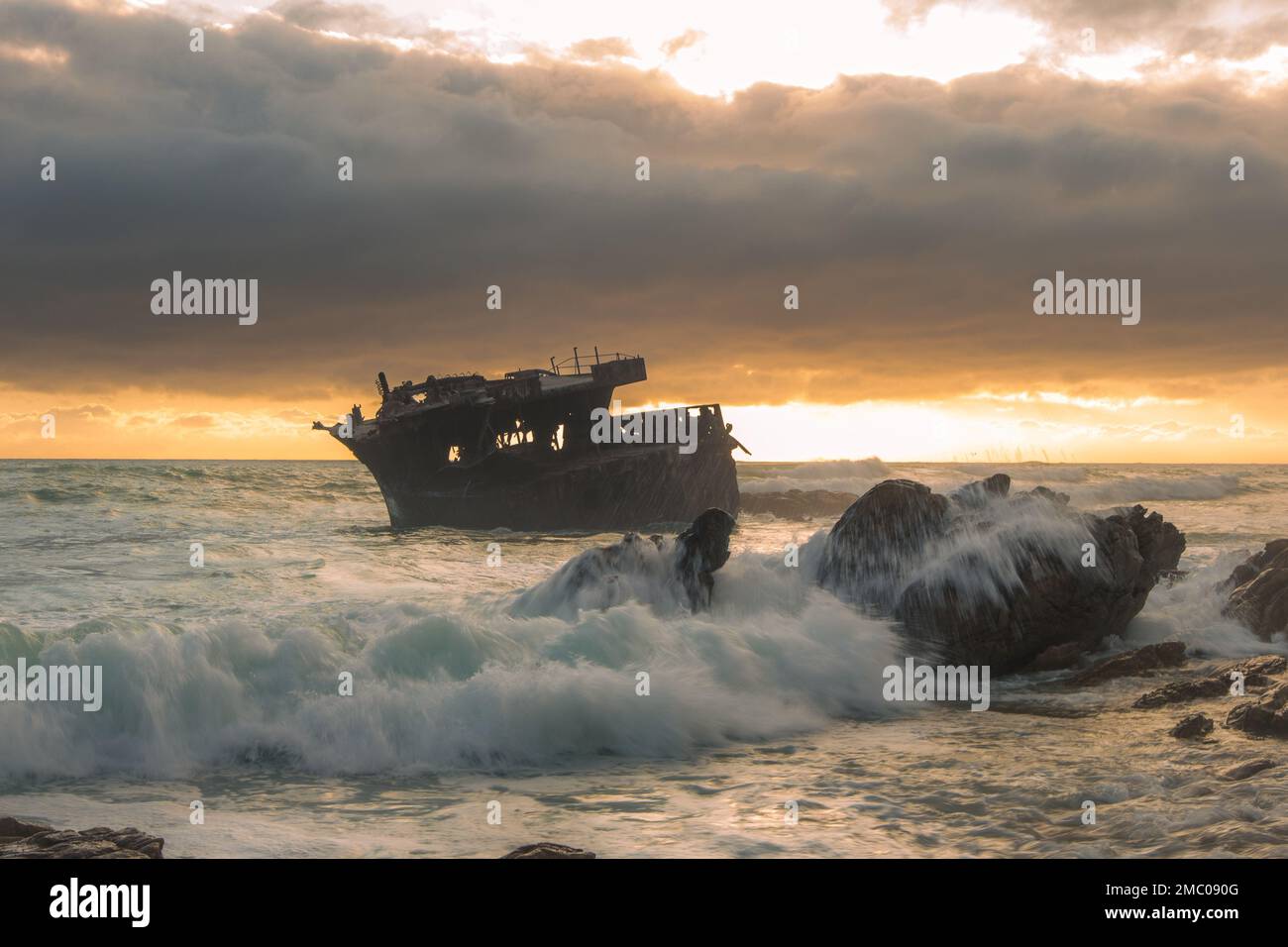An image of a sing ship in the waves of the sea during the yellow ...