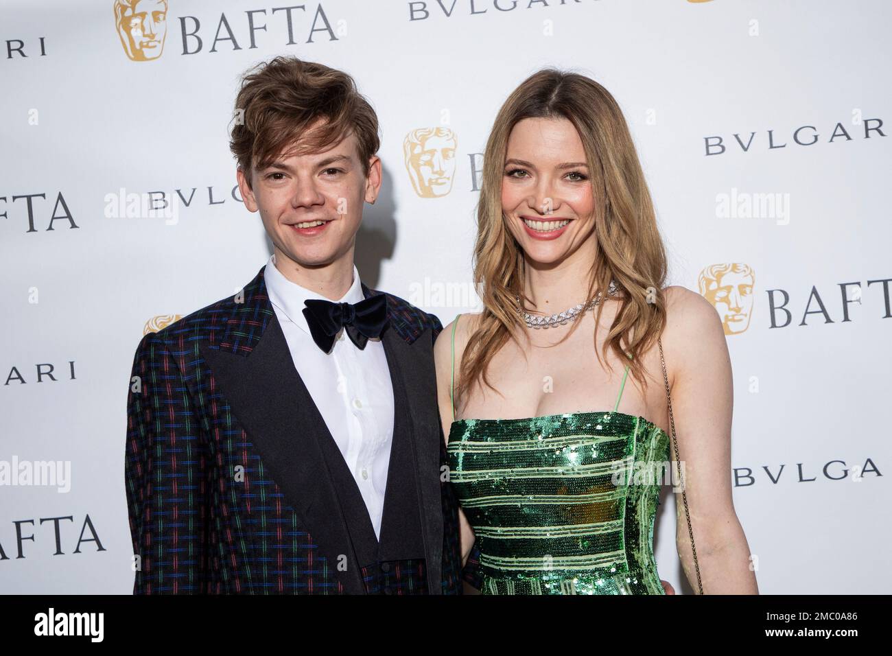 Talulah Riley, right, and Thomas Brodie-Sangster pose for photographers ...